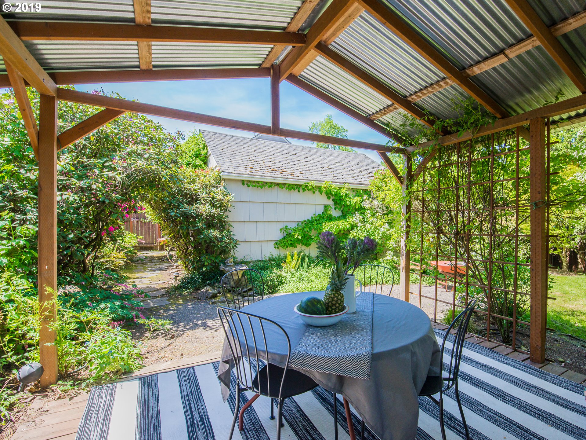 Garden Hideaway Loaded with Versatility! - Living Room Realty