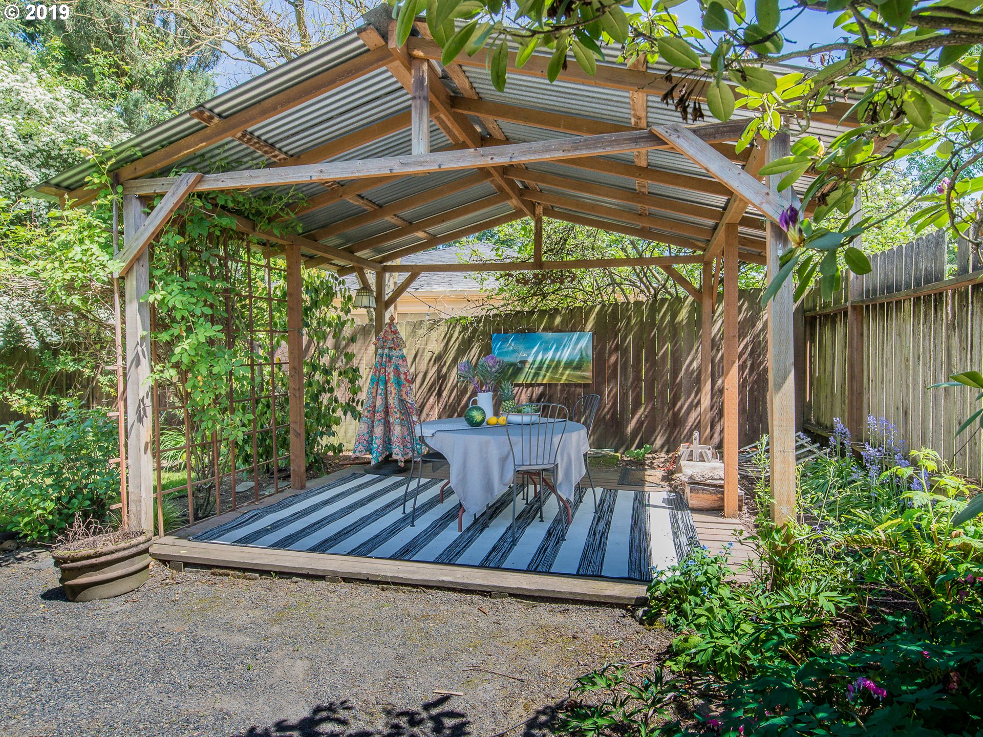 Garden Hideaway Loaded with Versatility! - Living Room Realty
